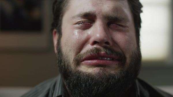Close up shot of man talking, crying and rubbing his face / Orem, Utah ...