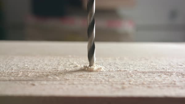 Close up of drill bit boring into wood - Stock Video Footage - Dissolve