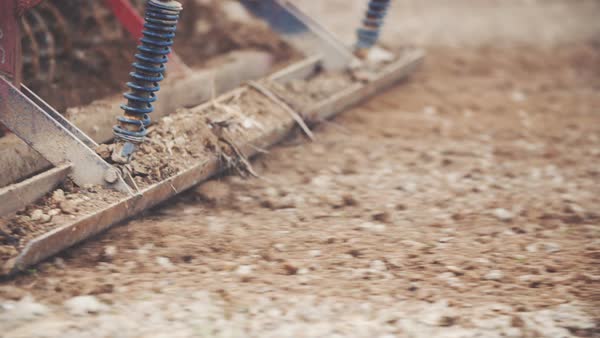 Tilling machine cultivating agricultural land - HD Royalty-free Stock ...