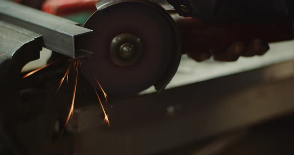 Steel Industry - Man using Angle Grinder Grinding Metal Object. - 4K ...
