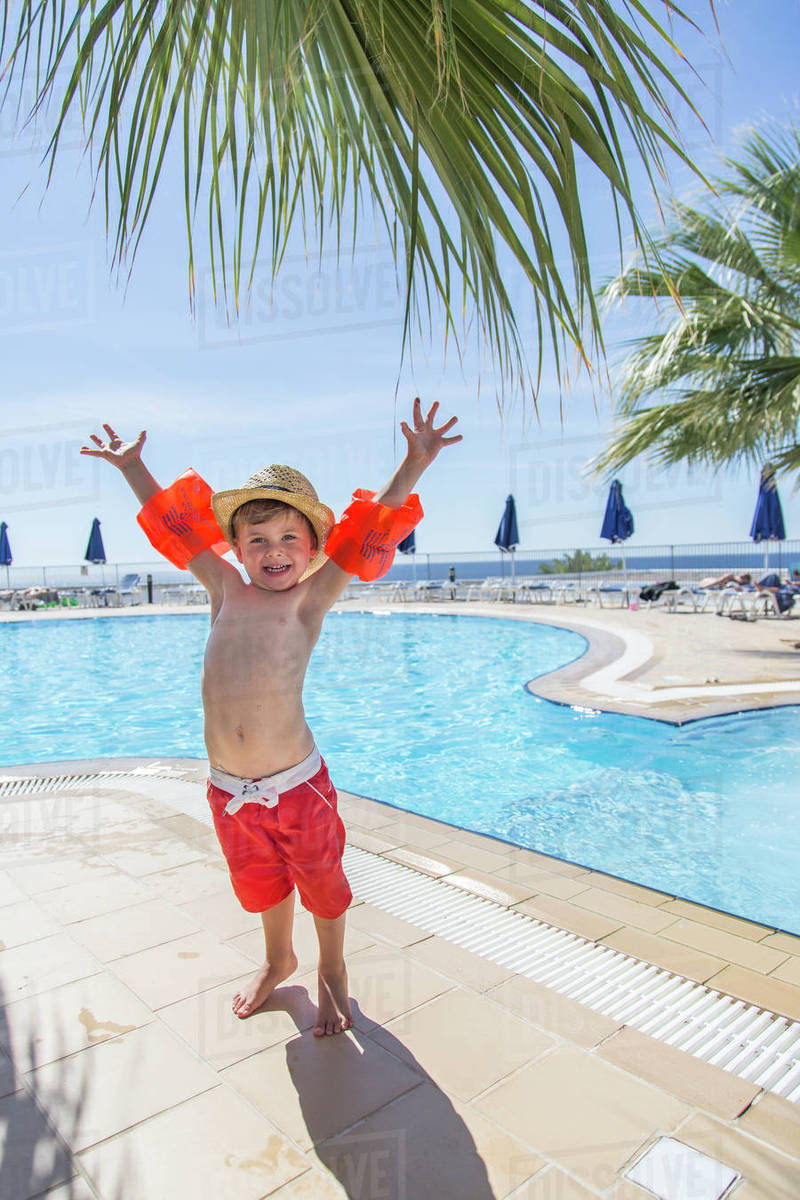 Happy boy at a swimingpool - Royalty-free Stock Photo | Dissolve