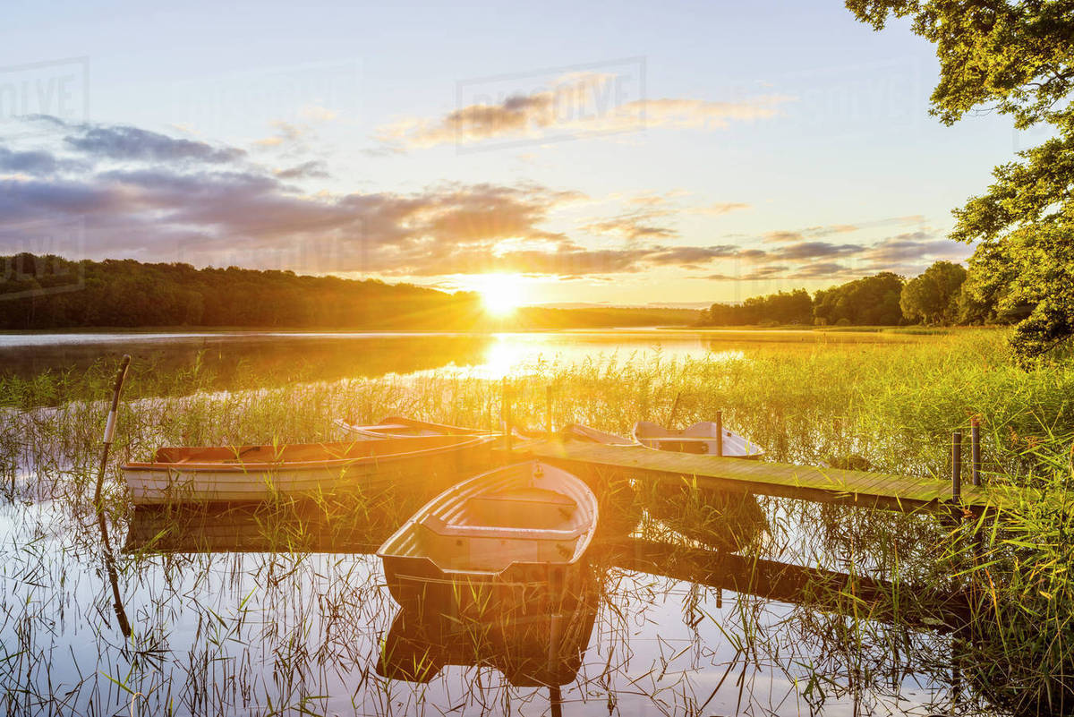 Rowboats at sunset - Royalty-free Stock Photo | Dissolve