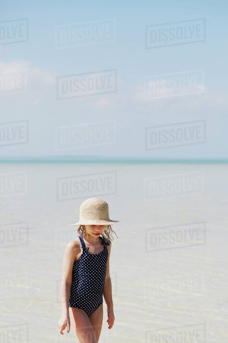Girl wading in sea - Royalty-free Stock Photo | Dissolve