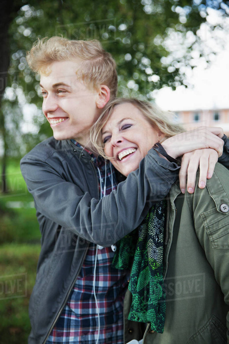 Young man with mother - Stock Photo - Dissolve