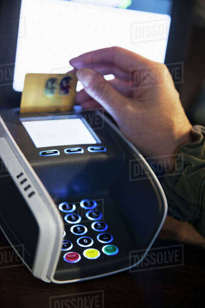 Hand putting bank card into card reader - Royalty-free Stock Photo ...