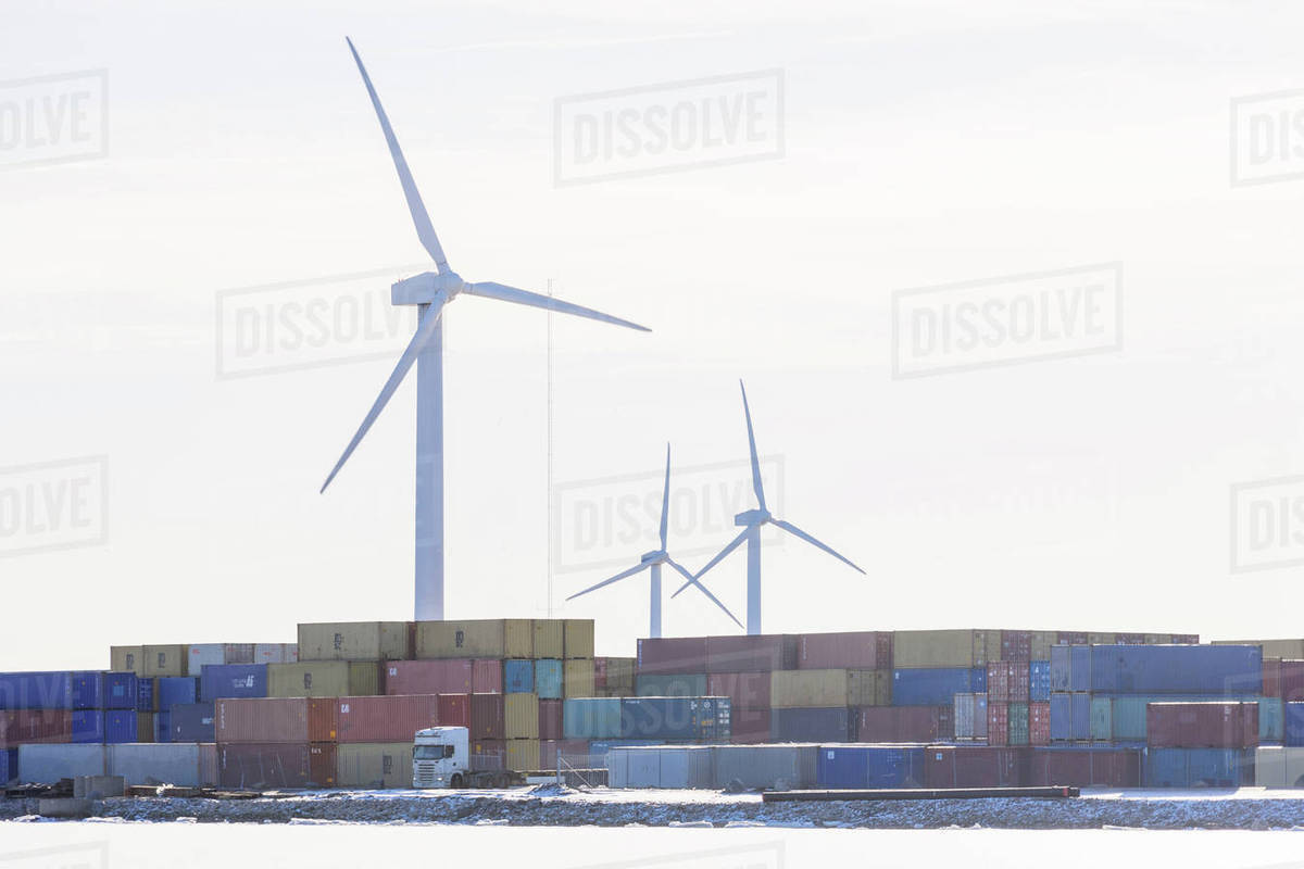Wind turbines, cargo containers on foreground - Royalty-free Stock ...
