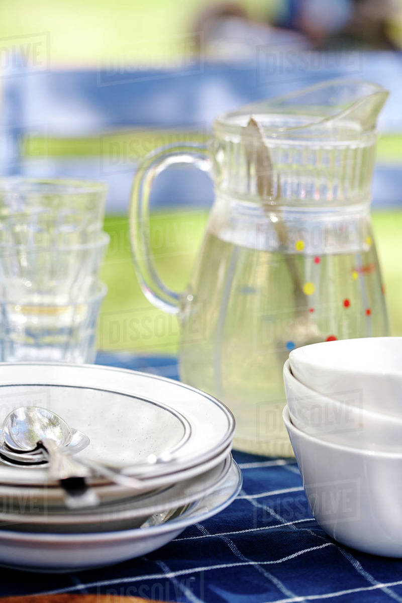 Bowls and jug on table - Stock Photo - Dissolve