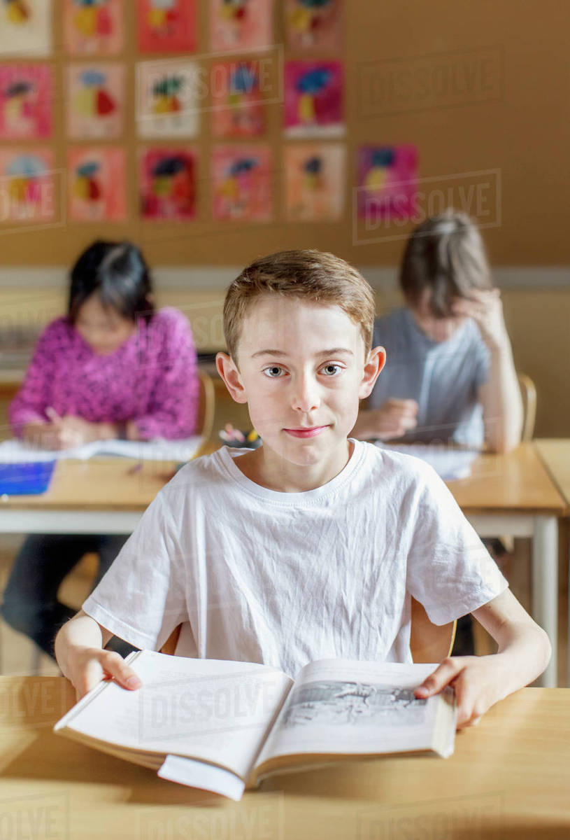 Boy in classroom - Stock Photo - Dissolve