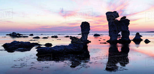 Coastal rock formations at sunset - Stock Photo - Dissolve