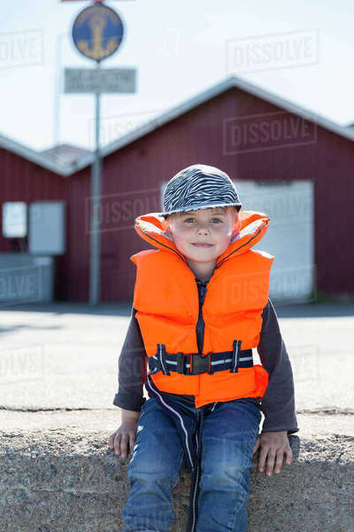 Boy wearing life jacket - Royalty-free Stock Photo | Dissolve