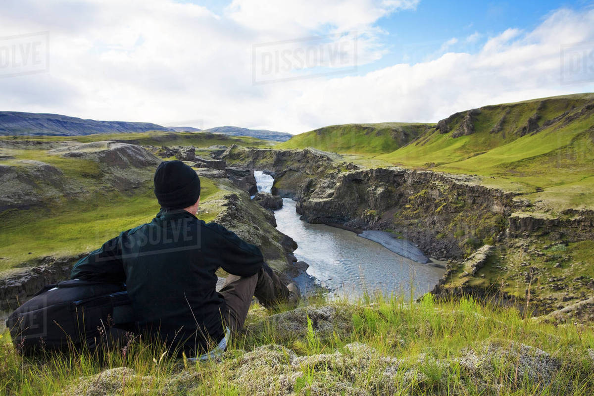 Man looking at river - Royalty-free Stock Photo | Dissolve