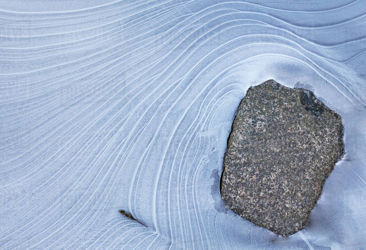 Ice pattern around stone - Royalty-free Stock Photo | Dissolve