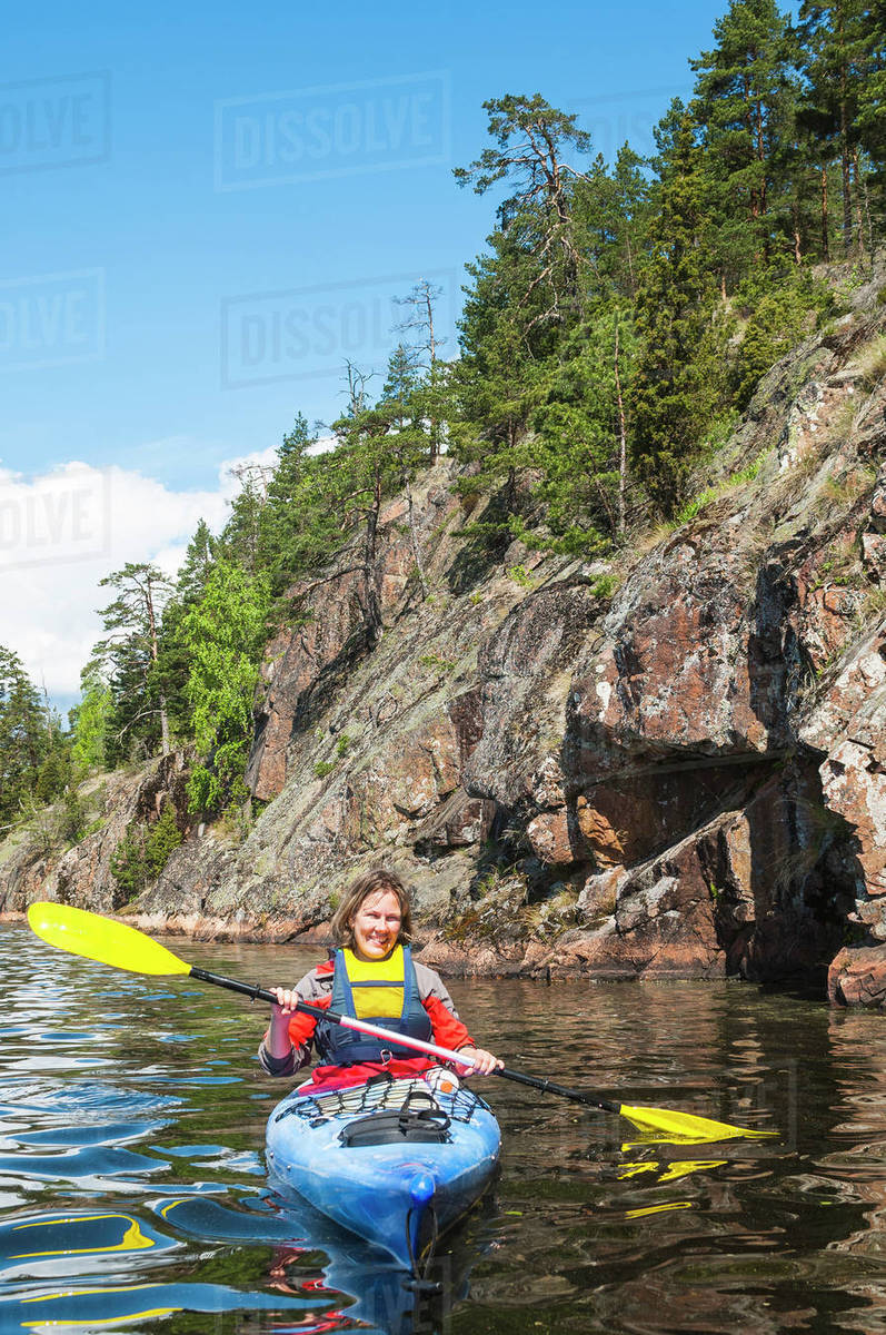 Woman kayaking - Royalty-free Stock Photo | Dissolve