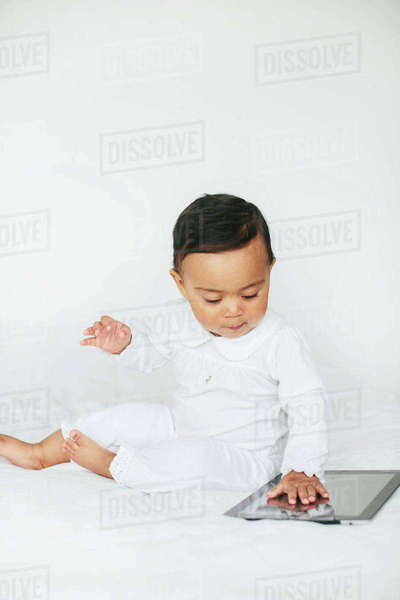 Baby with digital tablet - Stock Photo - Dissolve