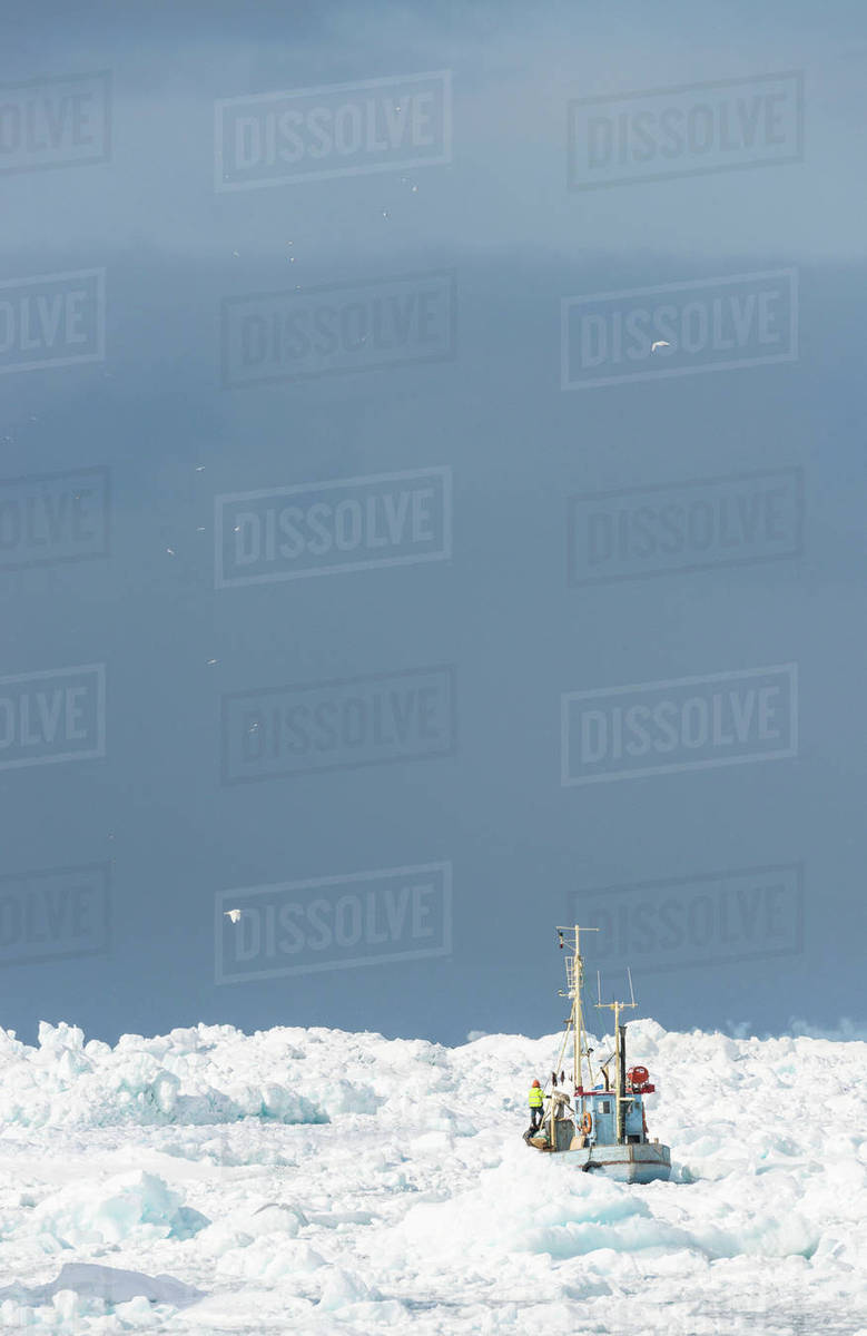 Boat in frozen sea - Royalty-free Stock Photo | Dissolve
