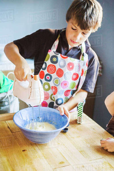 Teenage boy using mixer - Royalty-free Stock Photo | Dissolve