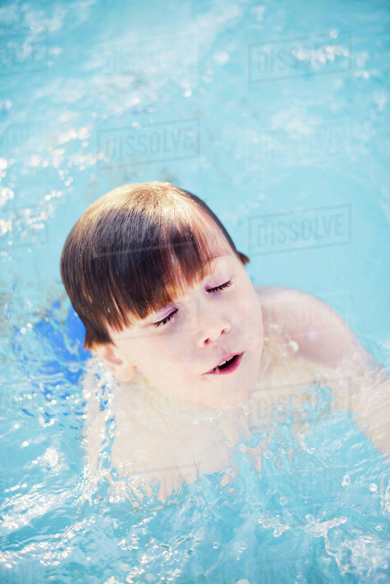 Boy in water - Stock Photo - Dissolve