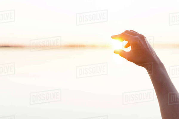 Hand holding sun - Royalty-free Stock Photo | Dissolve