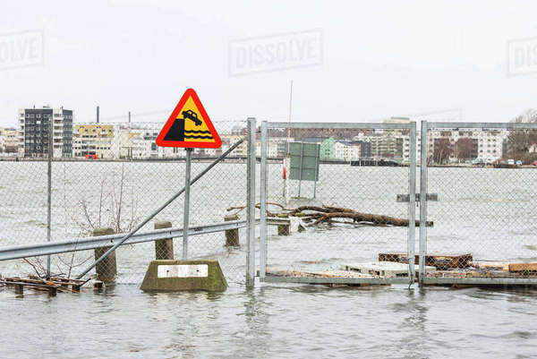 Warning floor in flooded place - Stock Photo - Dissolve