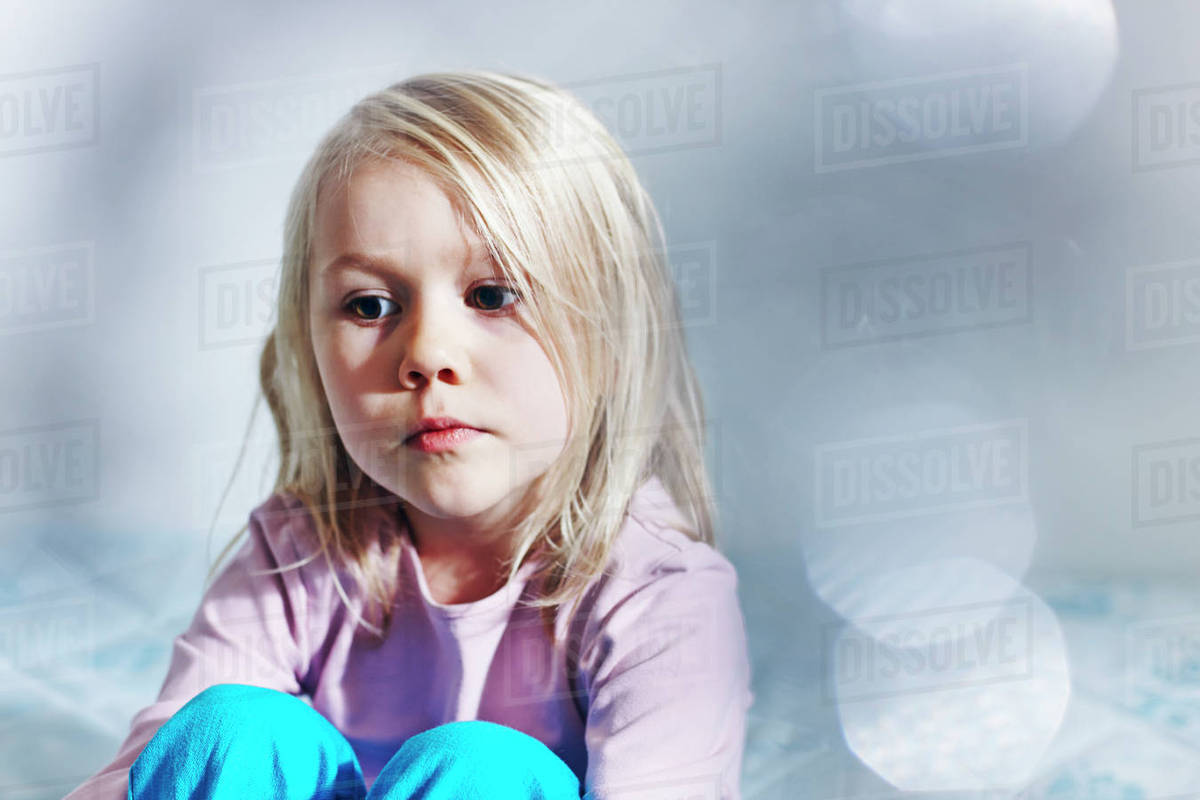 Sad girl looking away - Royalty-free Stock Photo | Dissolve