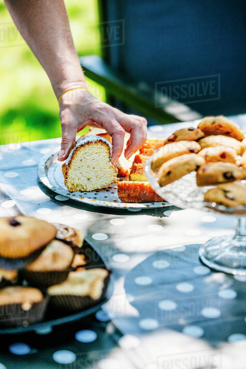 Hand taking cake - Royalty-free Stock Photo | Dissolve