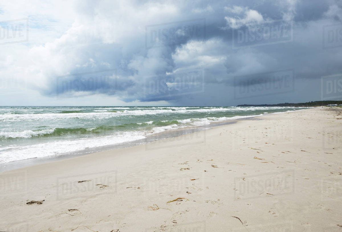 Storm clouds over beach - Royalty-free Stock Photo | Dissolve