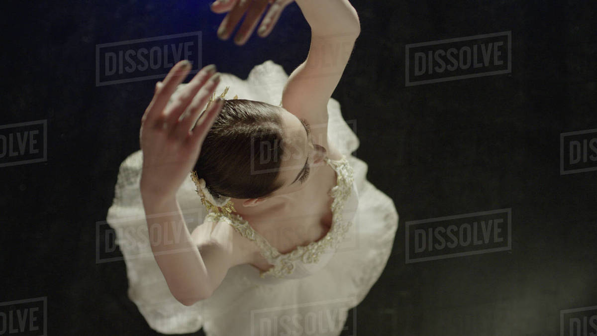 Overhead view of serious ballet dancer dancing in costume - Royalty ...