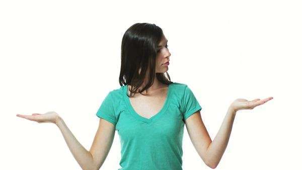 Woman holding both hands out - Stock Video Footage - Dissolve