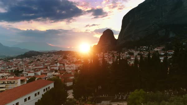 Aerial shot taking off over old European city Kalambaka or Kalampaka or ...