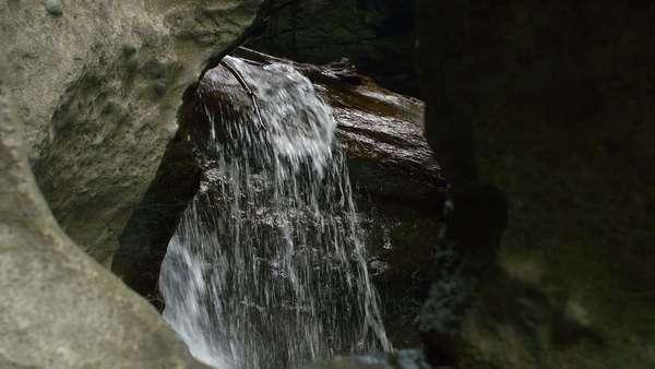 Small waterfall trickle through rocky window - Stock Video Footage ...