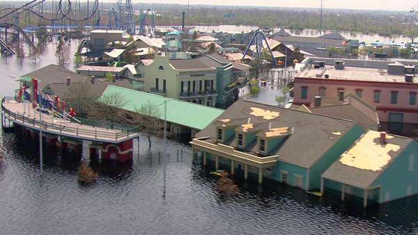 Medium shot POV aerial destruction of Six Flags New Orleans due to ...