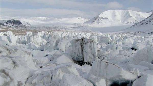Snow Rocky Bouldered Polar. A sweeping view explores a bouldered polar ...