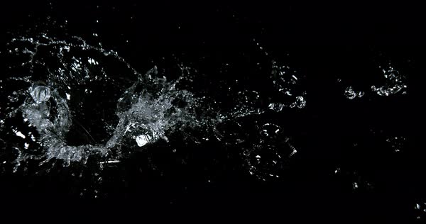 Water exploding and splashing against black background - Stock Video ...