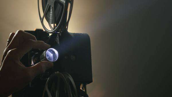 Vintage film projector rolling film - Stock Video Footage - Dissolve