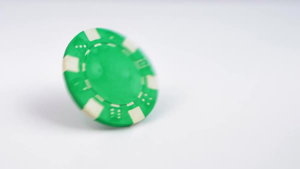 Green Poker Chip Spinning on White Background Slow Motion - HD Royalty ...