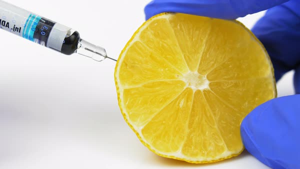 Poison injected into lemon from syringe by person in blue gloves - 4K ...