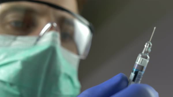 Doctor Performs Injection Wearing Surgical Mask Glasses and Gloves - 4K ...