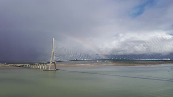 Impressive road bridge with flowing car and truck traffic in front of a ...