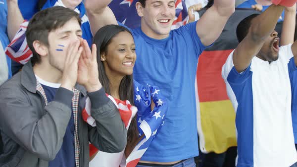 Excited sports crowd with national flags cheering on their teams - 4K ...