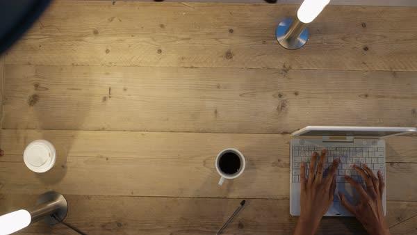 Overhead view looking down at office workspace, unrecognizable ...