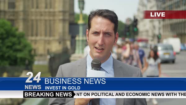 News reporter doing live piece to camera outside London Houses of ...