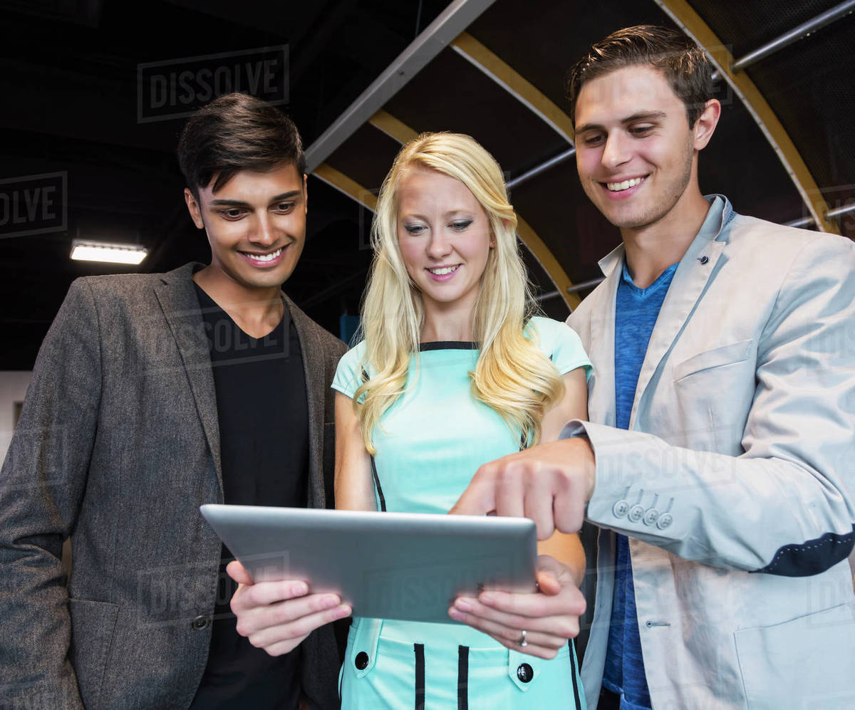 A group of young millennial business professionals in the workplace ...