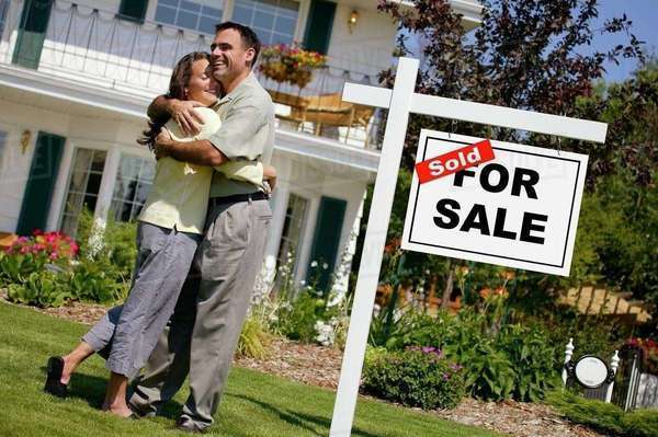 Couple Celebrates Buying New Home - Royalty-free Stock Photo | Dissolve