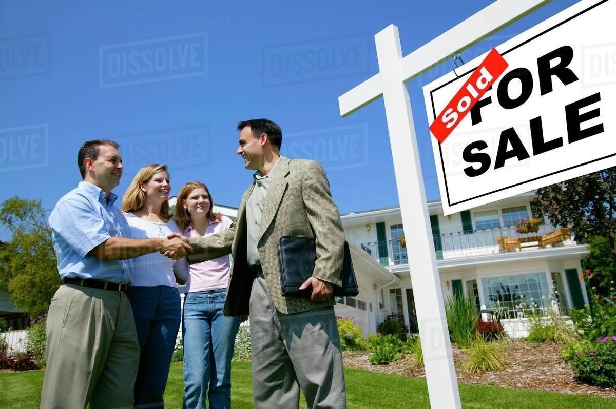 Shaking Hands With Realtor - Stock Photo - Dissolve