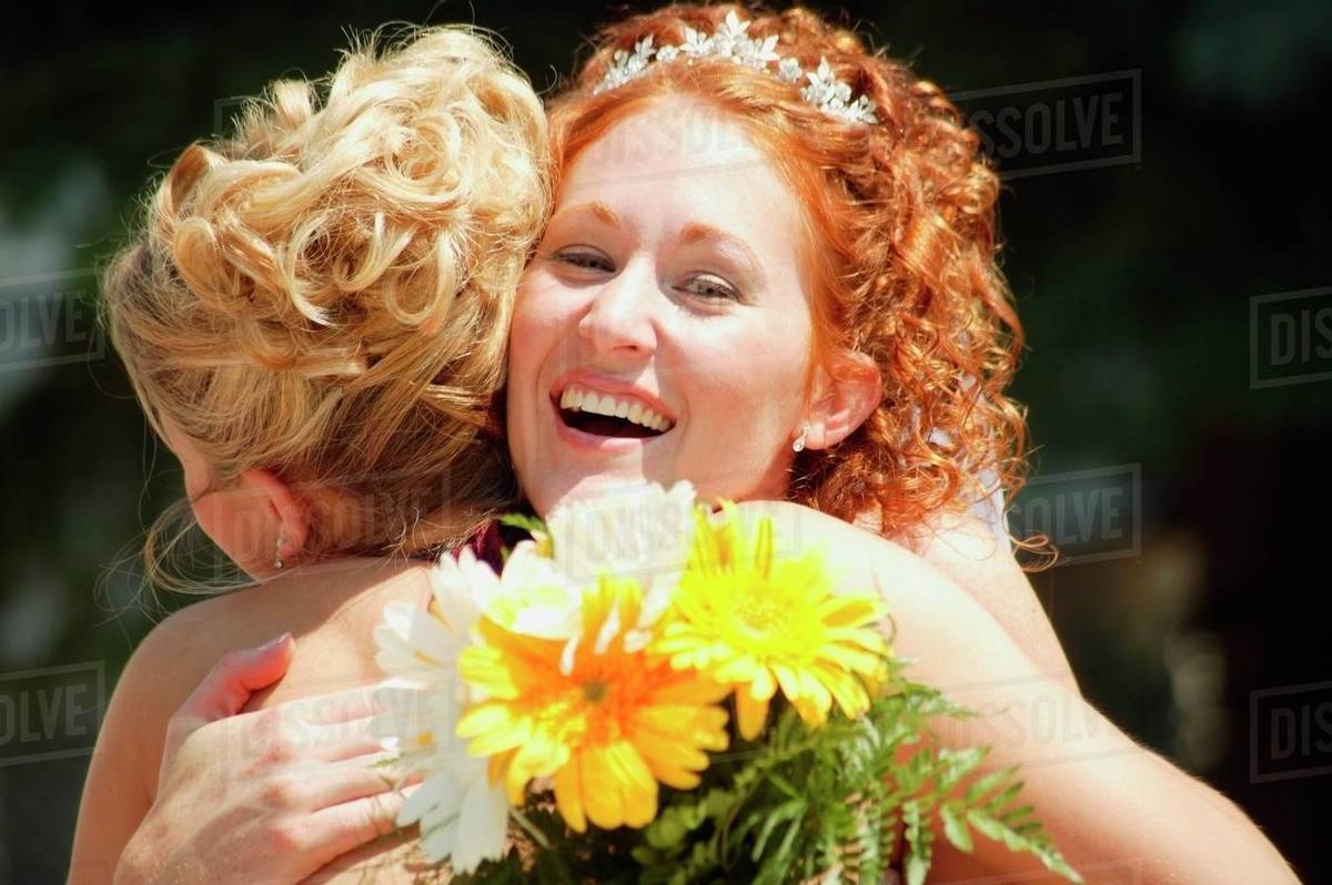 A Hug Of Congratulations - Stock Photo - Dissolve