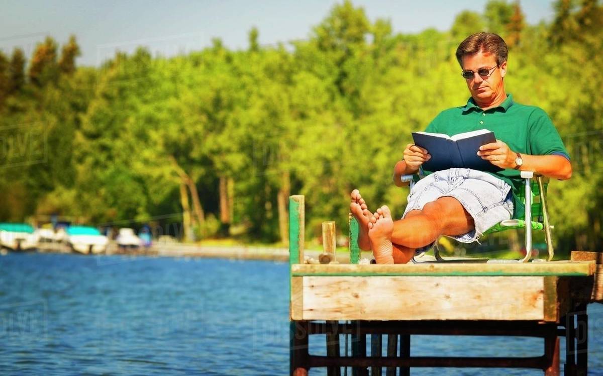 Reading A Book At The Lake - Royalty-free Stock Photo | Dissolve