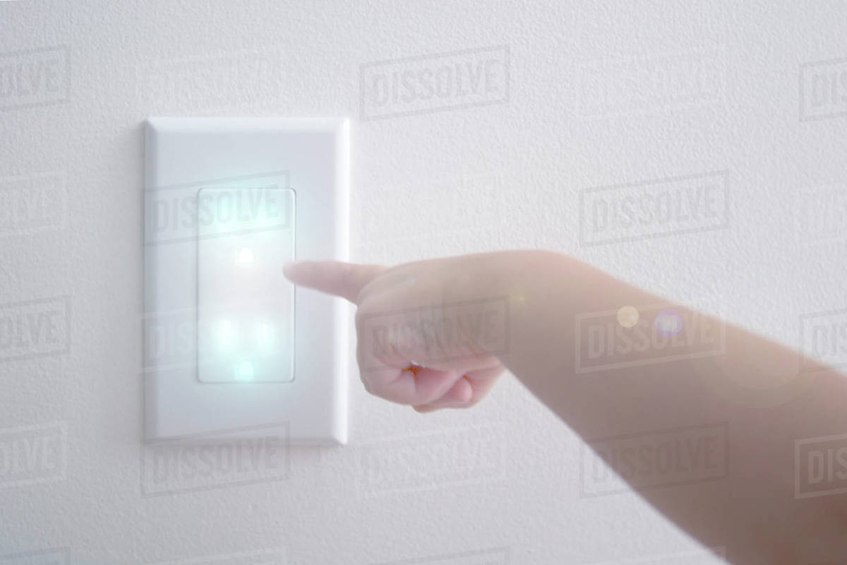Child's Finger Pointing At Electrical Outlet - Stock Photo - Dissolve