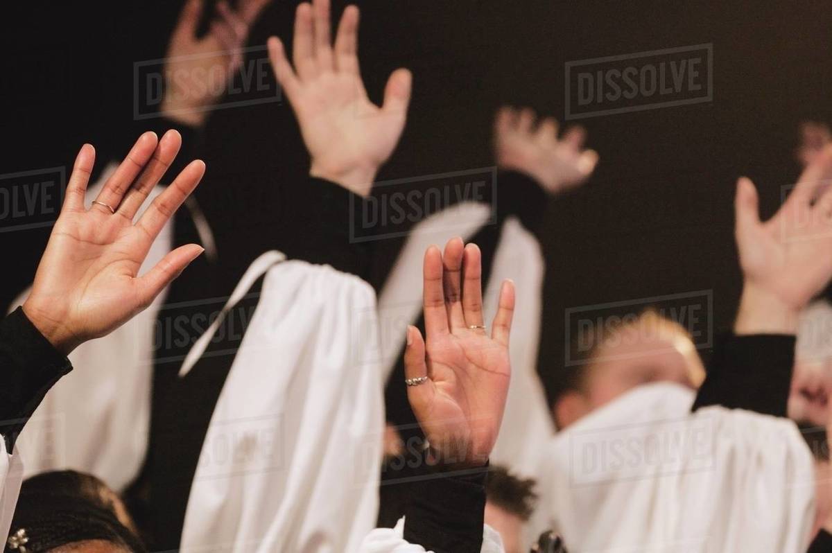 Hands Raised In Worship - Stock Photo - Dissolve