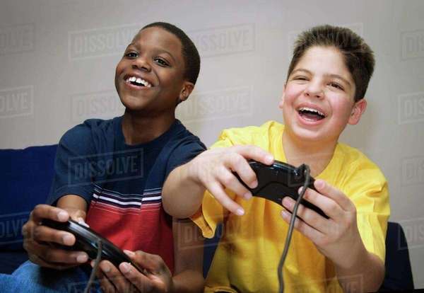 Two Boys Playing A Video Game - Royalty-free Stock Photo | Dissolve