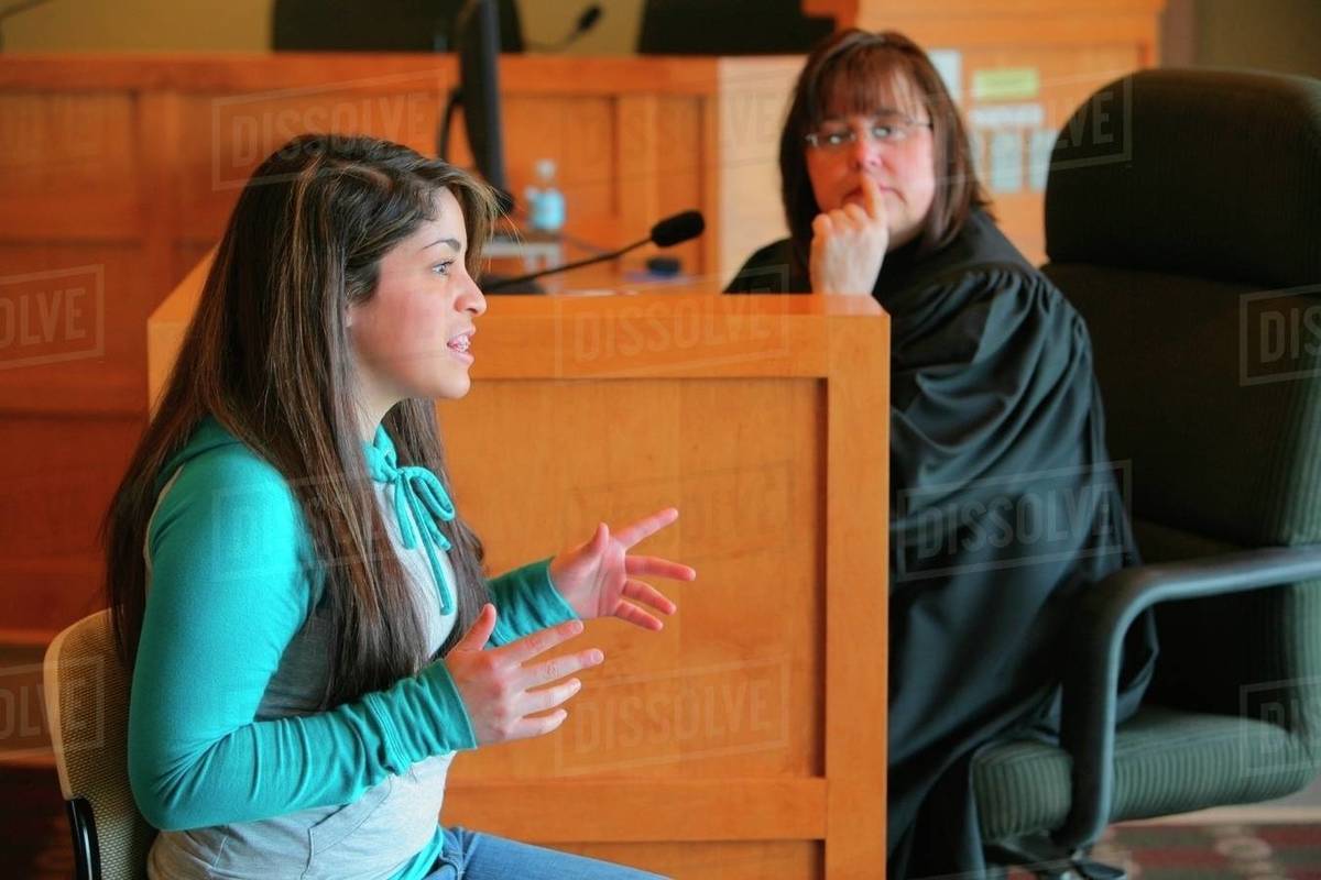 A Teenage Girl Giving Her Testimony Before A Judge - Royalty-free Stock ...